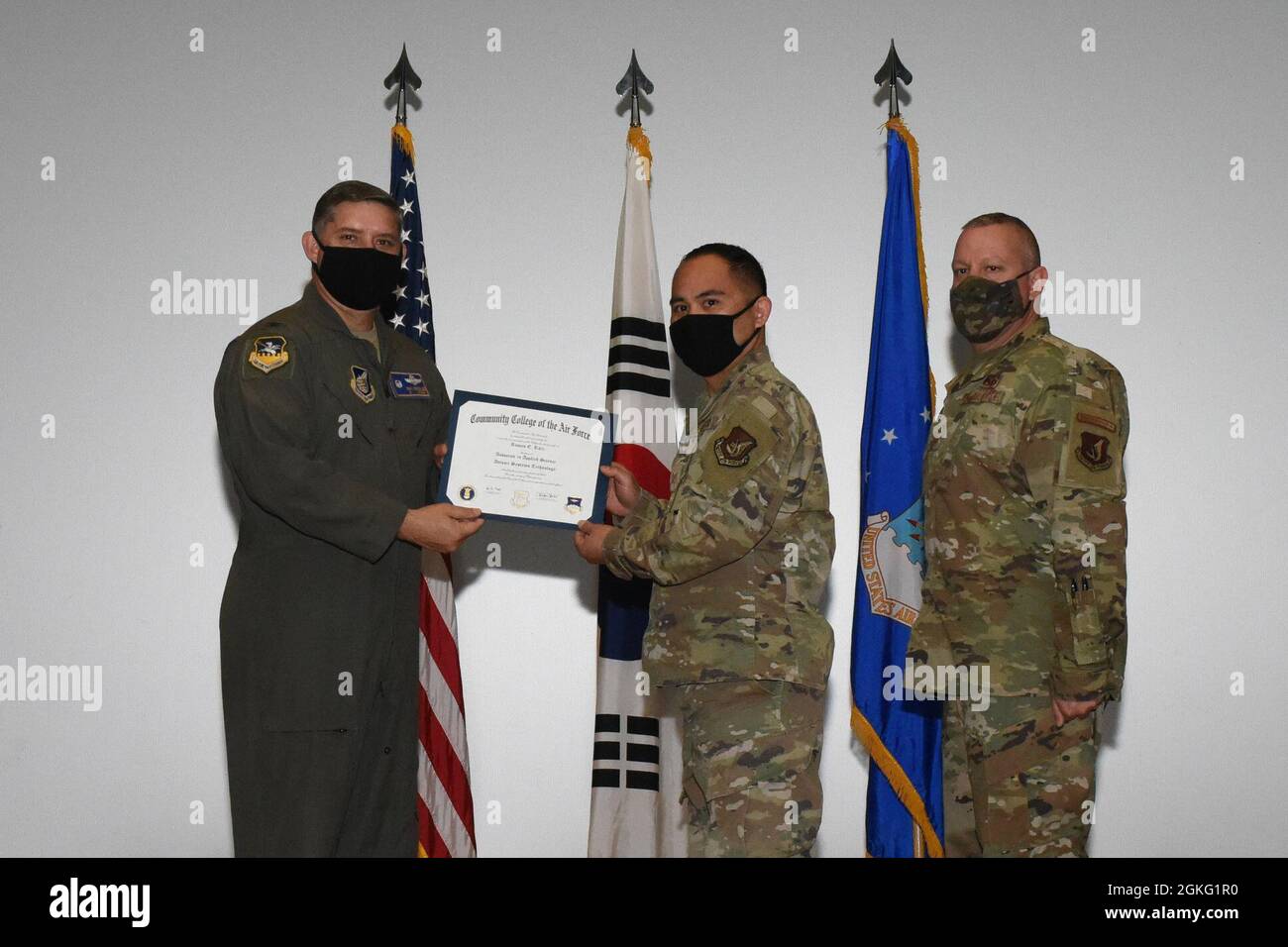 Tech. Sgt. Romeo Ruiz, 51st Aircraft Maintenance Squadron, receives his ...