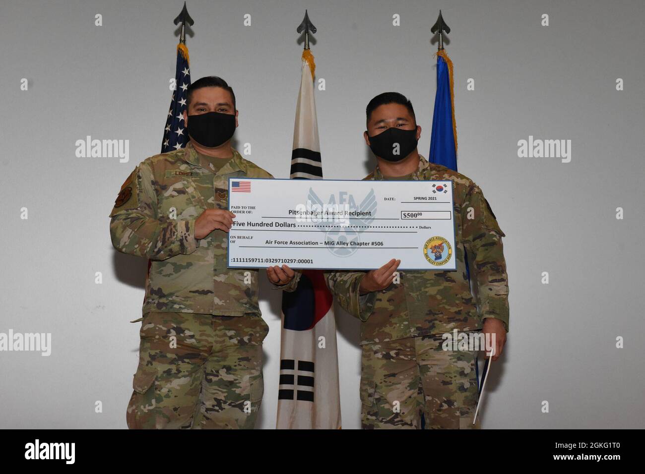 Staff Sgt. Angelo Patungan, 51st Logistics Readiness Squadron, receives ...