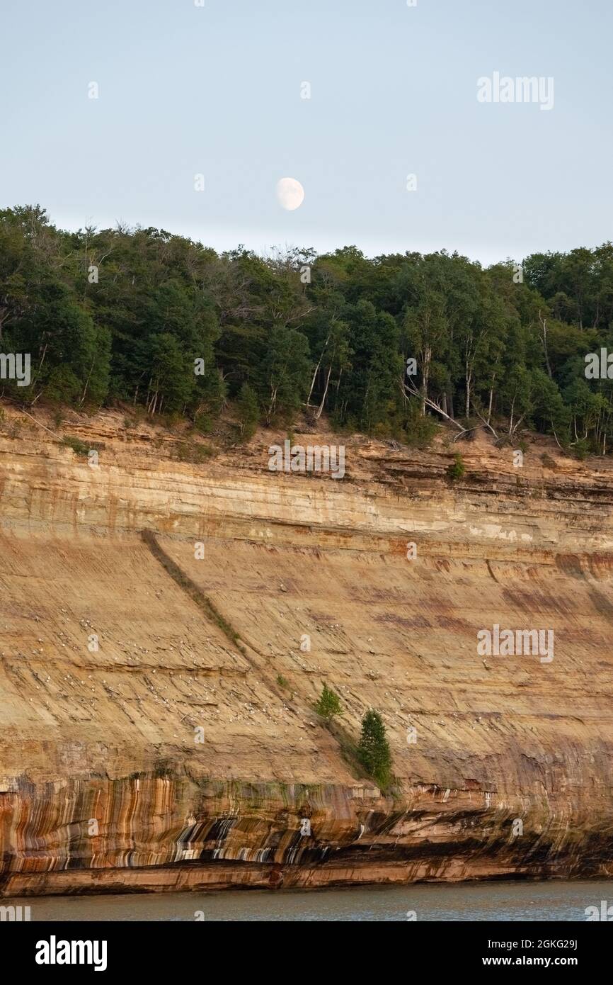Rising moon over rocky coastline hi-res stock photography and images ...