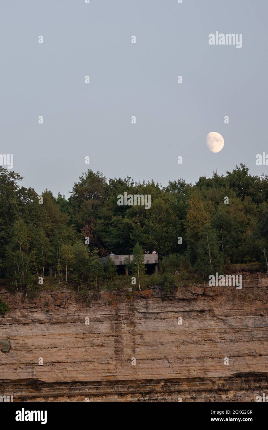 Moon rising over the viewing platform at Miners Castle along Pictured ...
