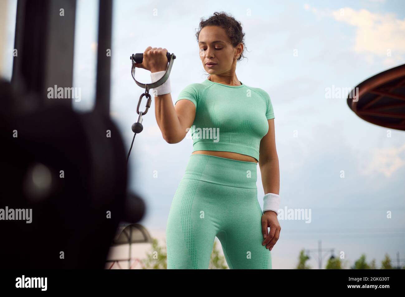 Female doing cable crossover exercises hi-res stock photography and ...
