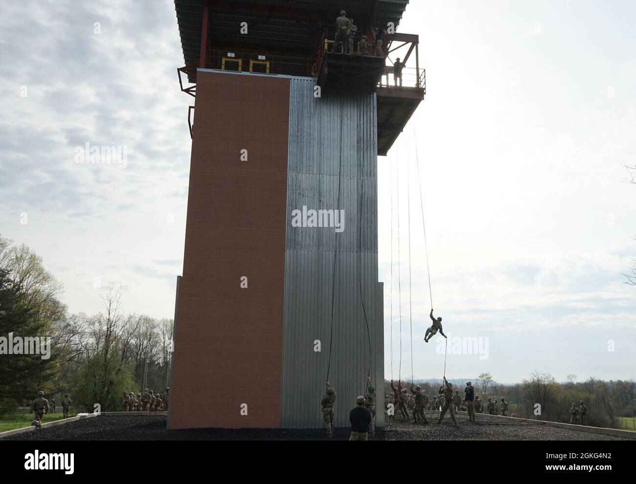 Soldiers in the Air Assault class rappel while their classmates belay ...