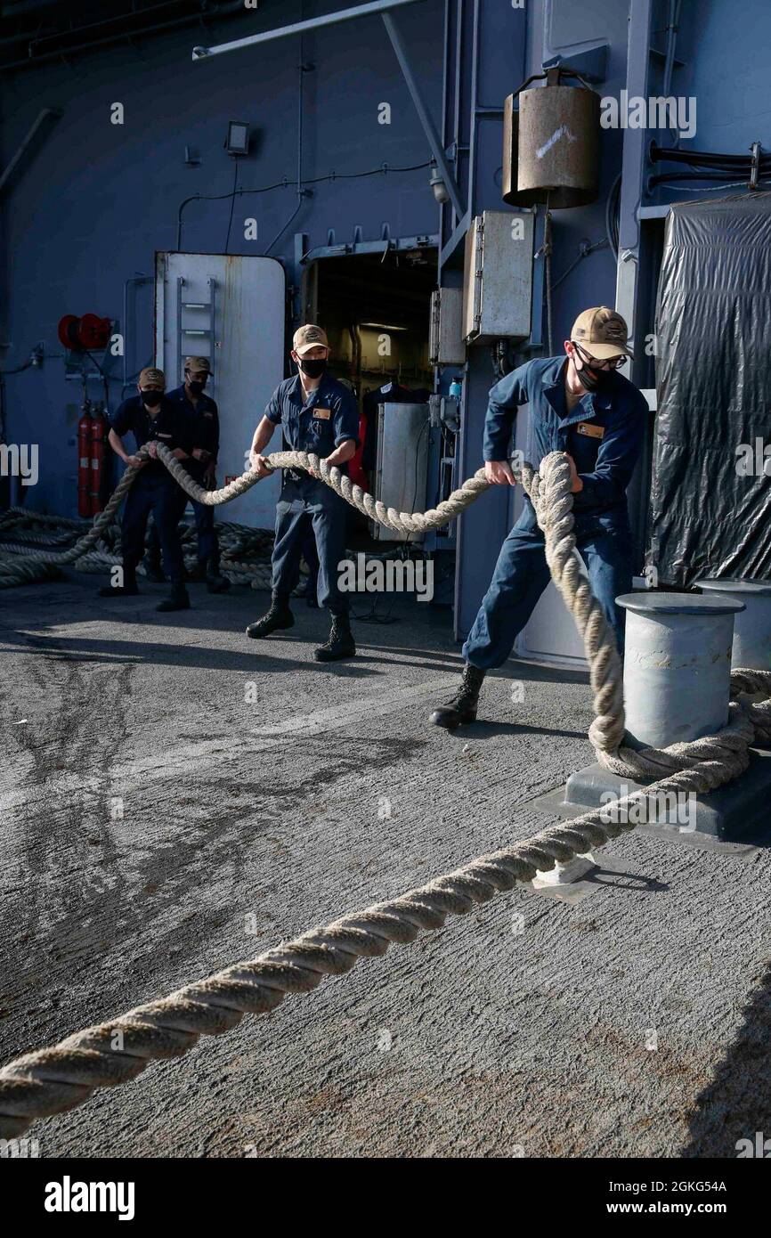210414-N-MM912-1015 SAN DIEGO (April 14, 2021) Sailors handle line on ...