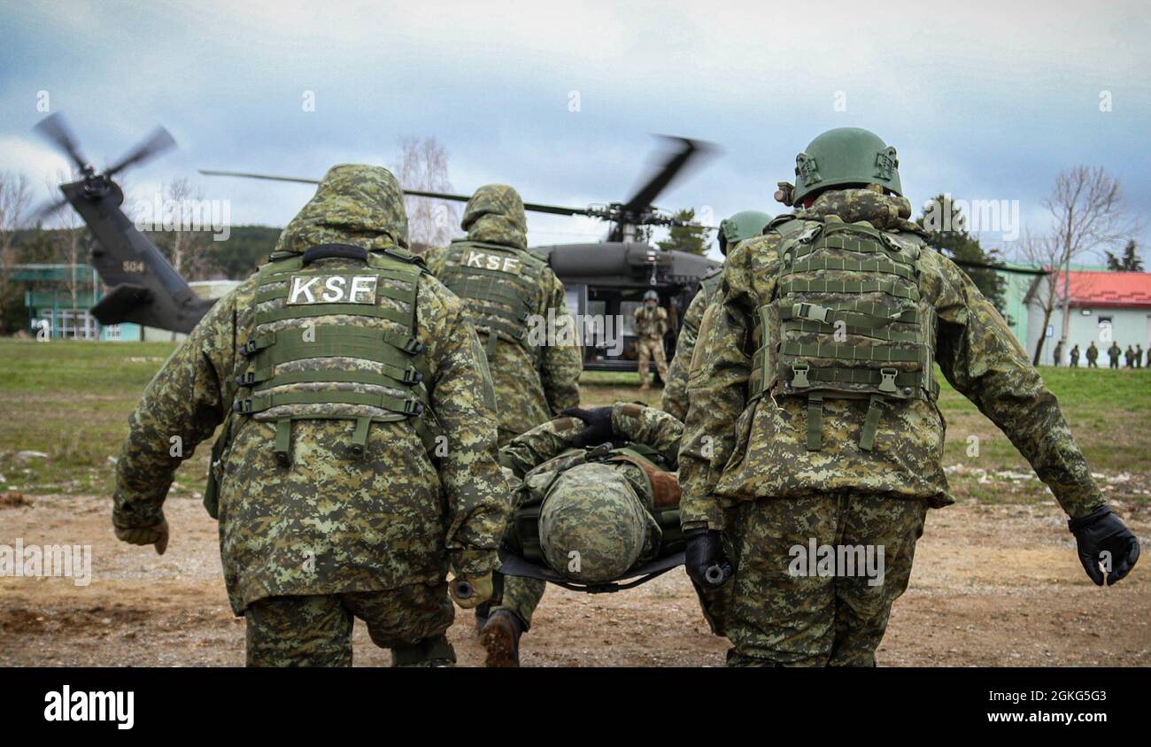 Kosovo Security Force members practice loading a patient onto a UH-60 ...