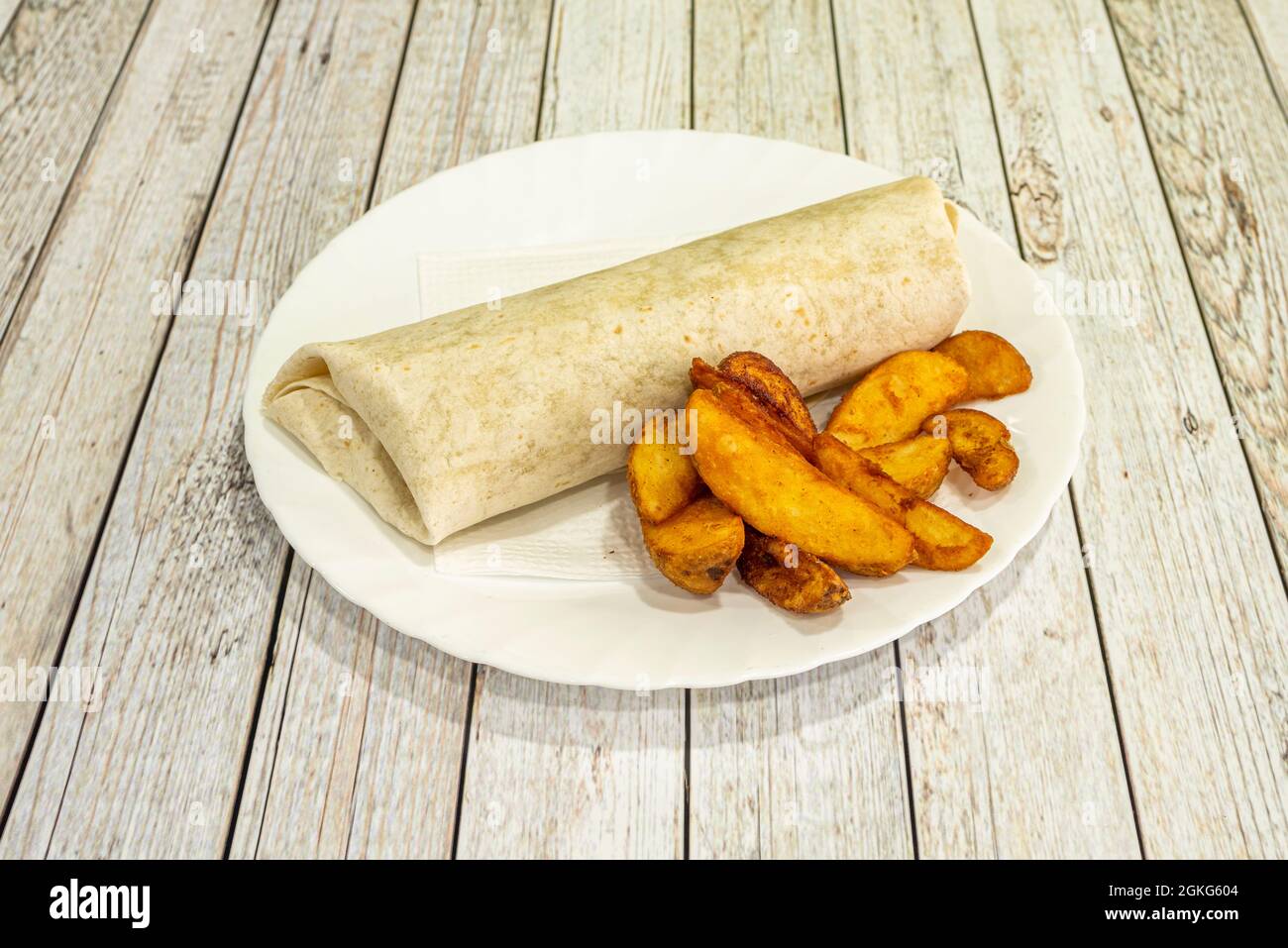 Stuffed wheat dough lahmacun served in a European kebab restaurant with ...