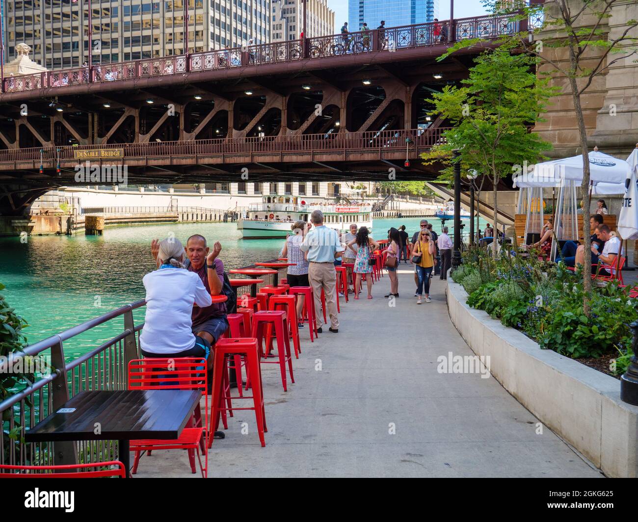 People enjoying the Chicago Riverwalk near the DuSable Bridge and ...