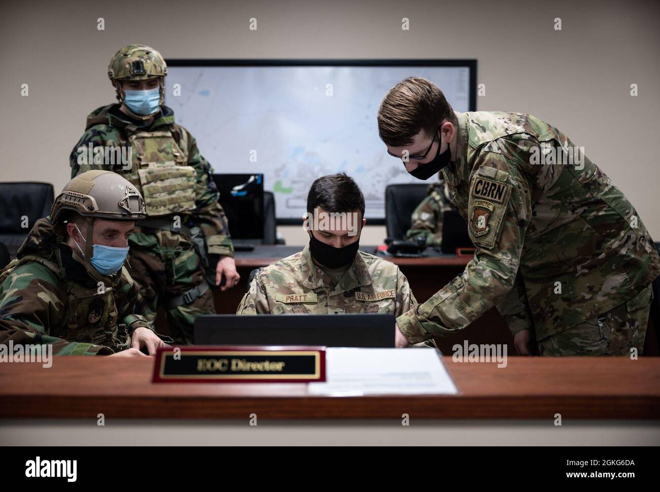 U.S. Airmen from the 354th Civil Engineering Squadron hold a mock ...
