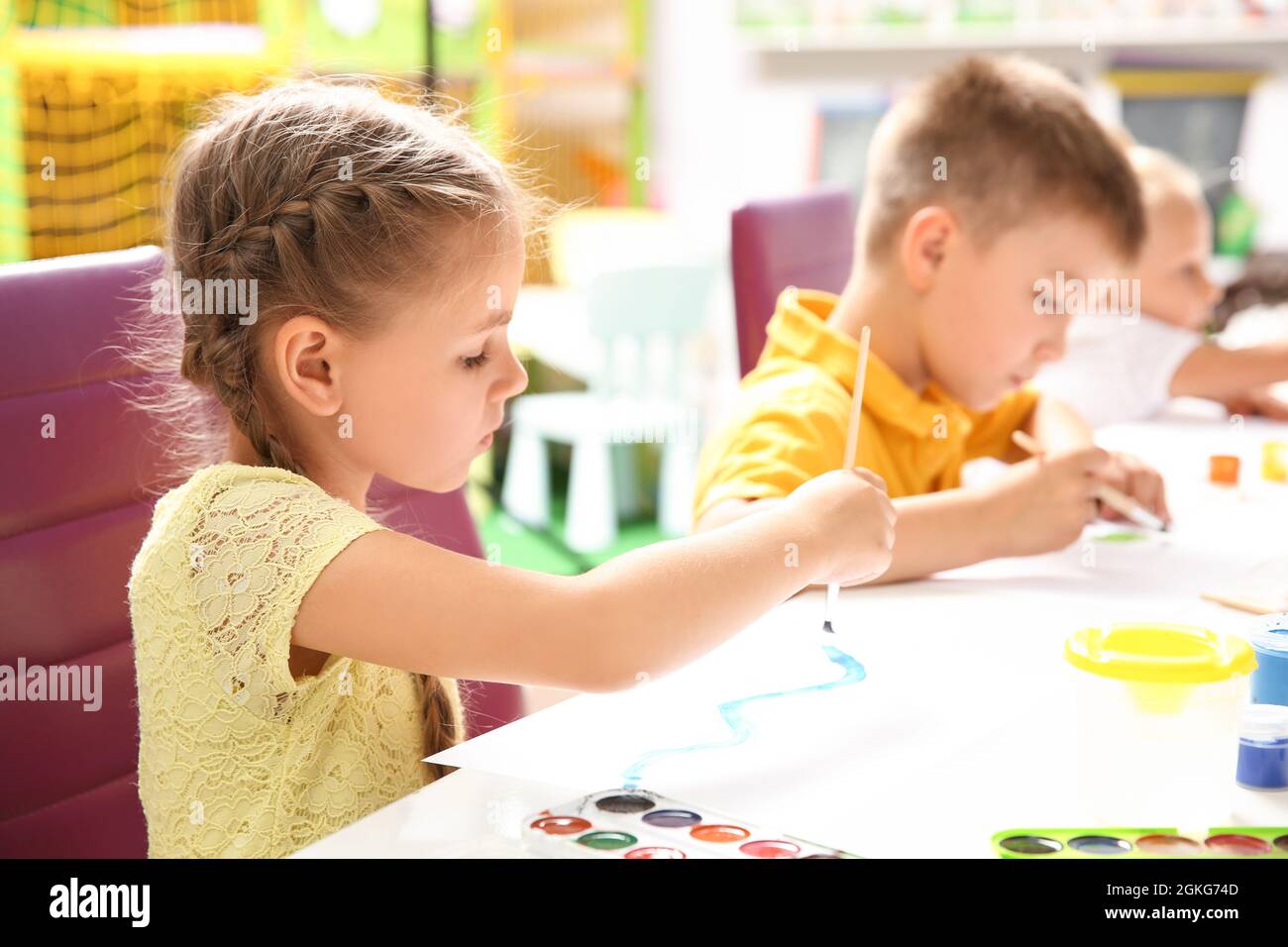 Little children at painting lesson in classroom Stock Photo - Alamy