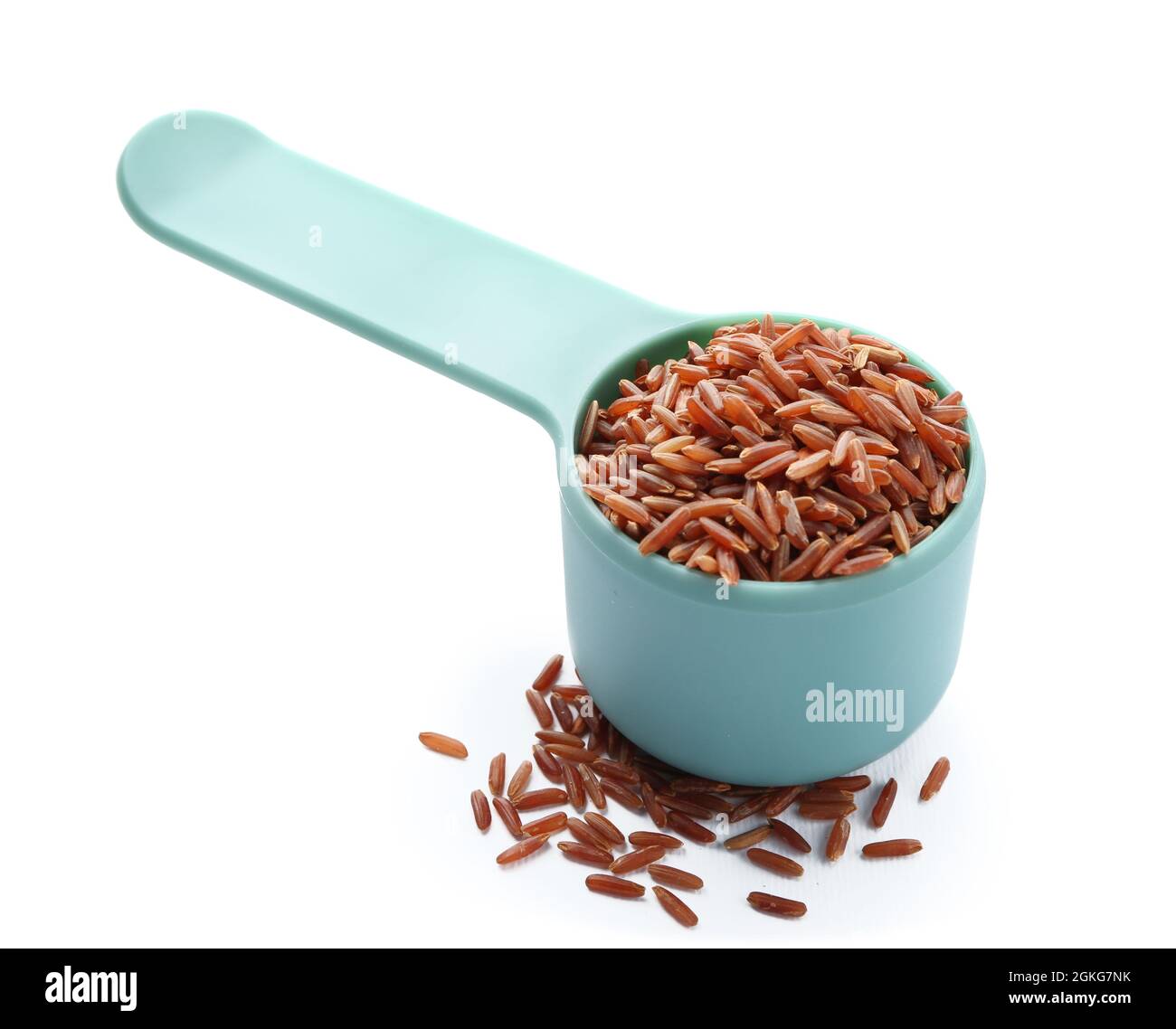 Measure scoop with red Cargo rice on white background Stock Photo - Alamy