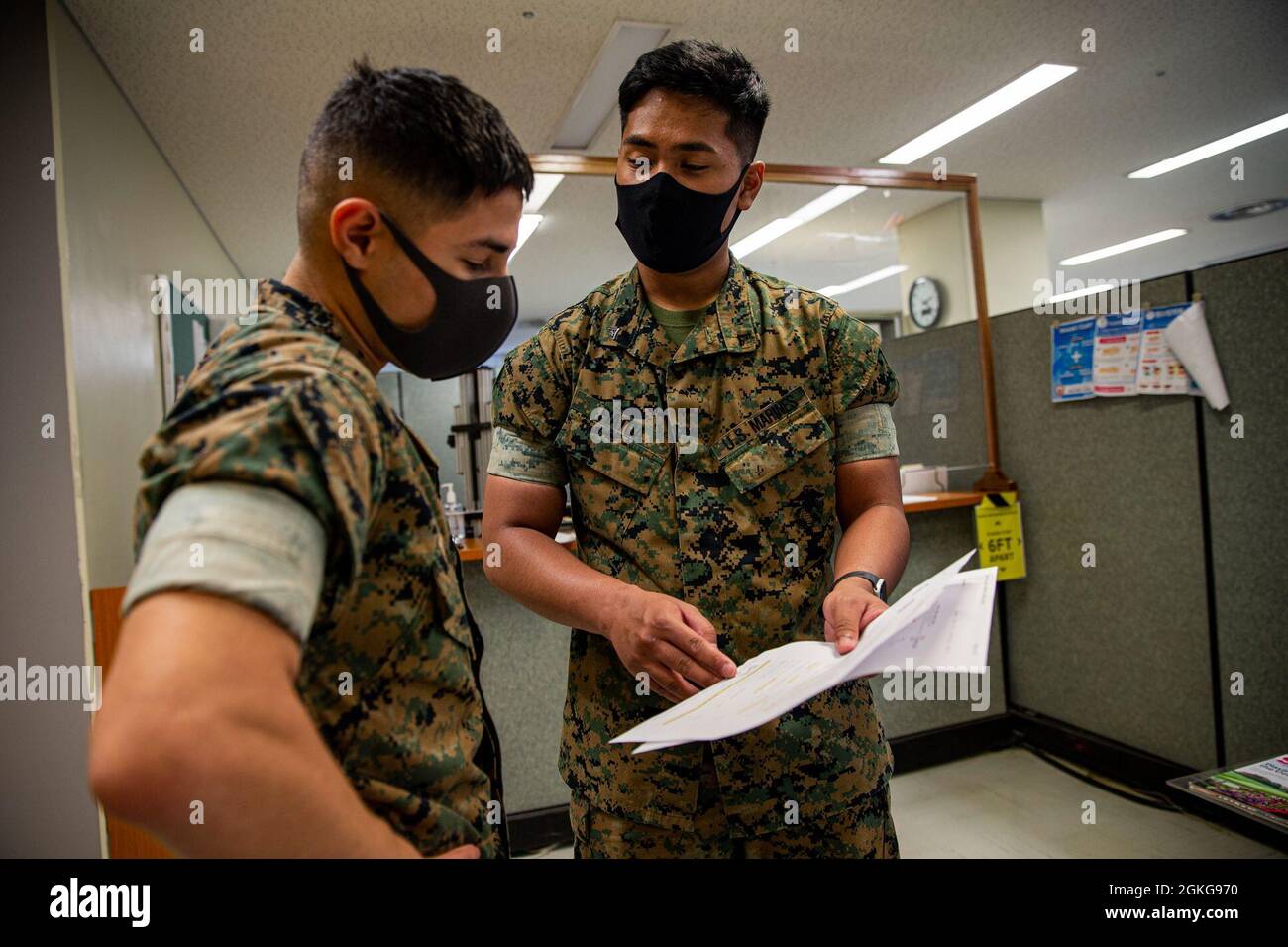 U.S. Marine Corps Lance Cpl. Xavier Fiatoa and Lance Cpl. Marco Altunez ...