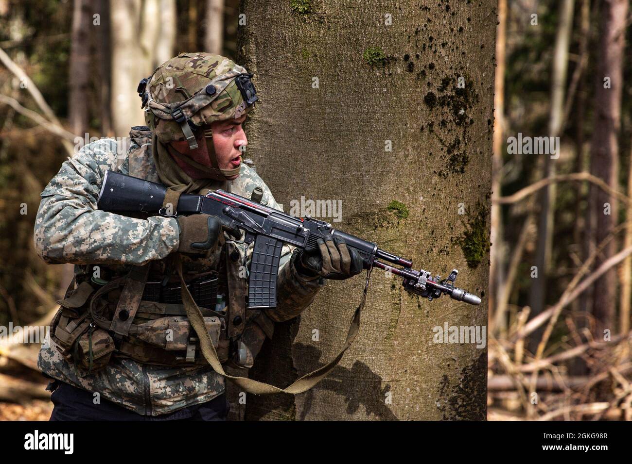 A soldier with the 1st Battalion, 4th Infantry Regiment OPFOR engages ...