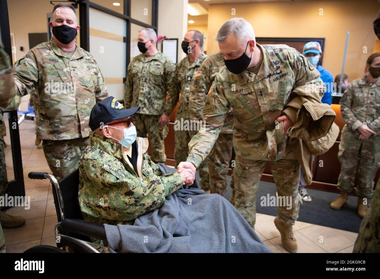 Mr. Ken Potts, (seated) one of only two living survivors that were ...