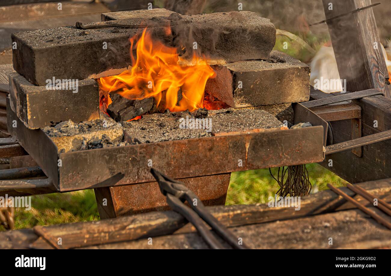 A burning fire in a forge for forging iron products Stock Photo - Alamy