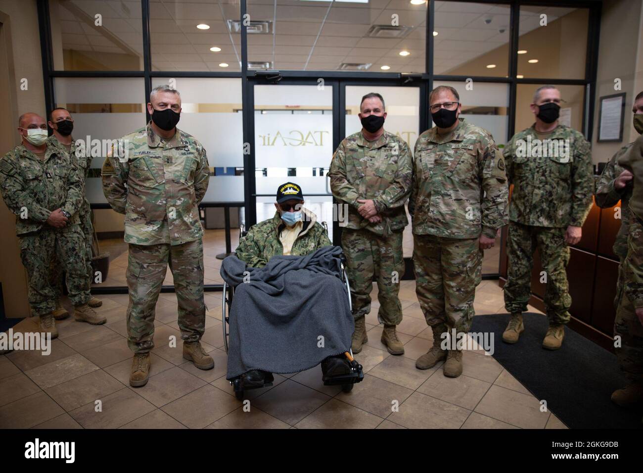 Mr. Ken Potts, (seated) one of only two living survivors that were ...