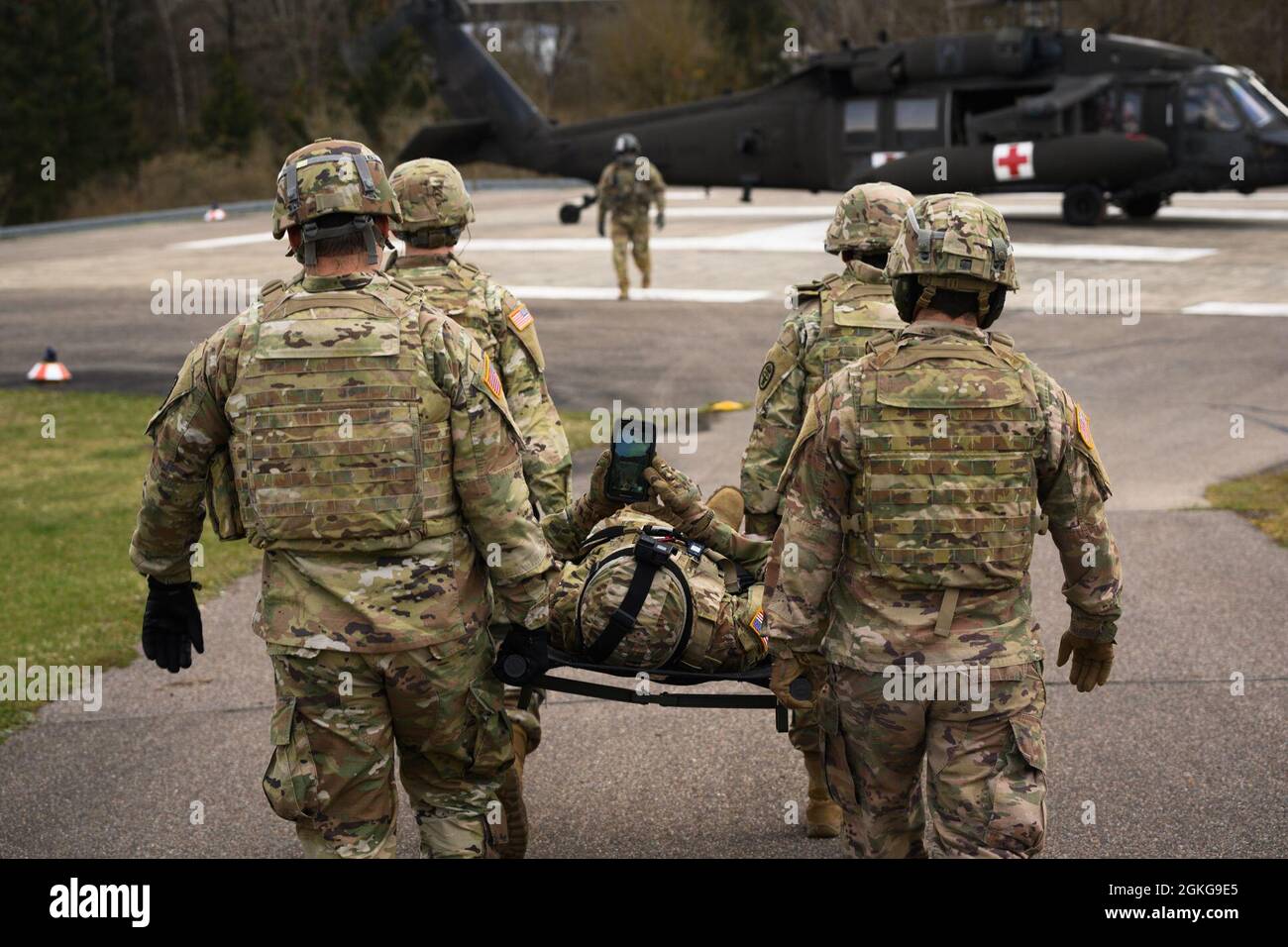U.S. Army Soldiers from the Hohenfels Clinic transport a litter patient ...