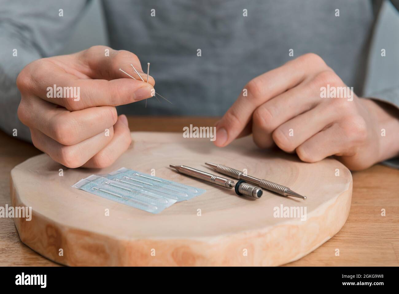 Acupuncture treatment on man's hands. Rehabilitation using alternative ...