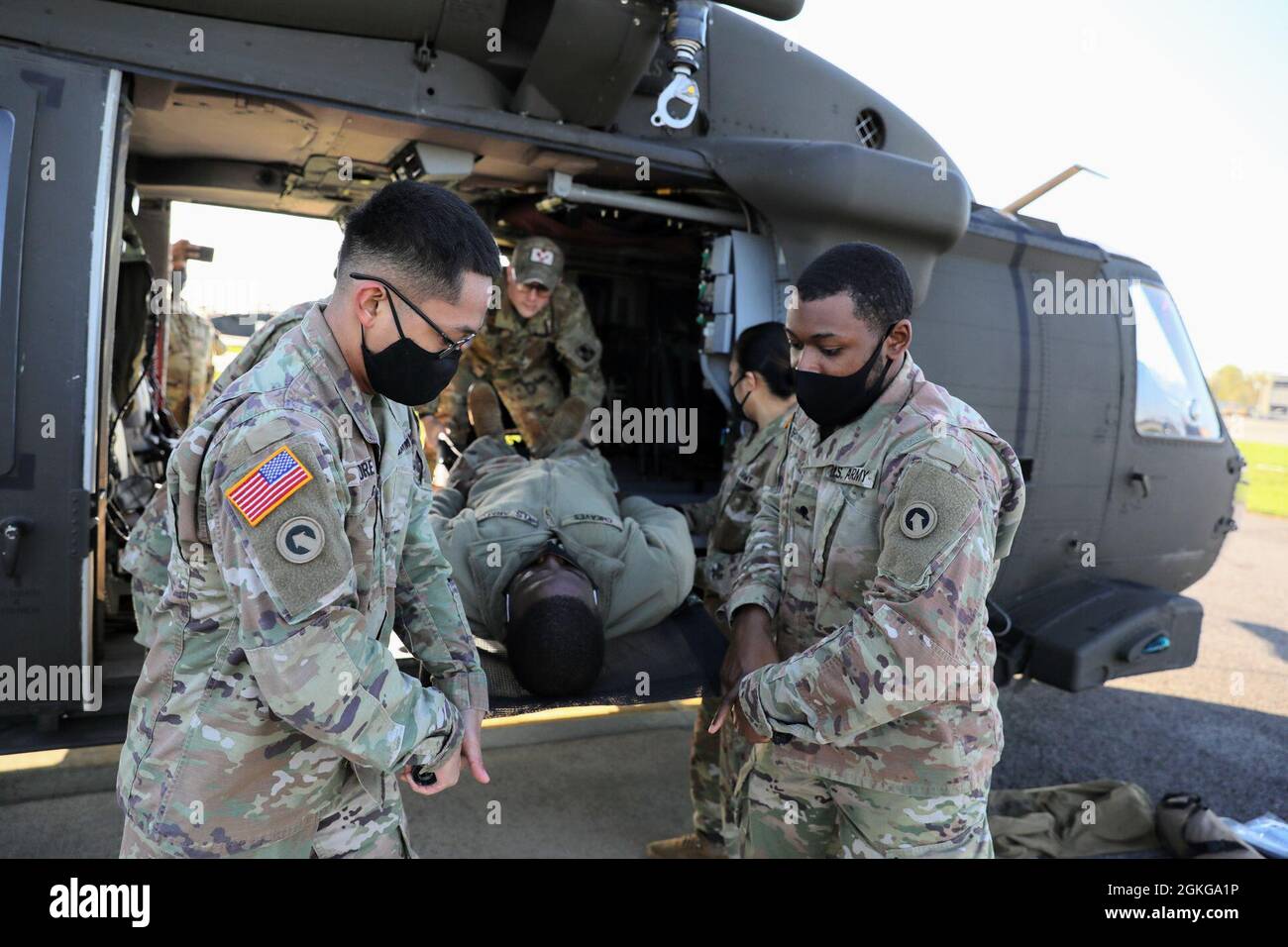 1st Theater Sustainment Command Soldiers unload a simulated casualty ...