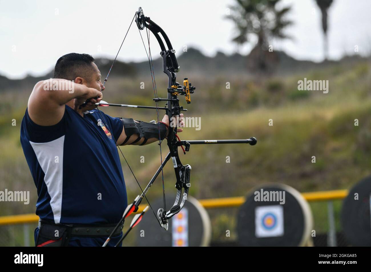 U.S. Marine Corps Staff Sgt. Raymond Cardoza competes in the archery ...