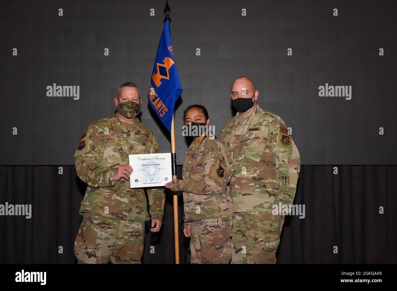 Master Sgt. Jannie Brooks, 7th Air Force, accepts her certificate of ...