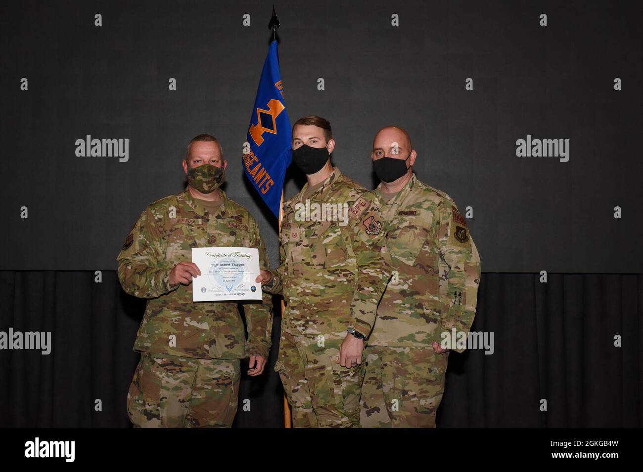 Tech. Sgt. Robert Thigpen, 51st Operations Support Squadron, accepts ...