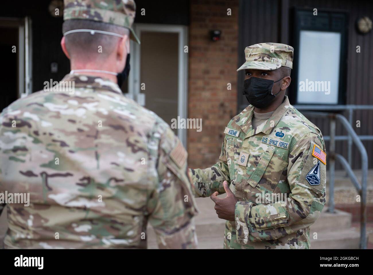 U.S. Space Force Master Sgt. Rajab Kigembe, right, 423rd Communications Squadron flight chief of ...