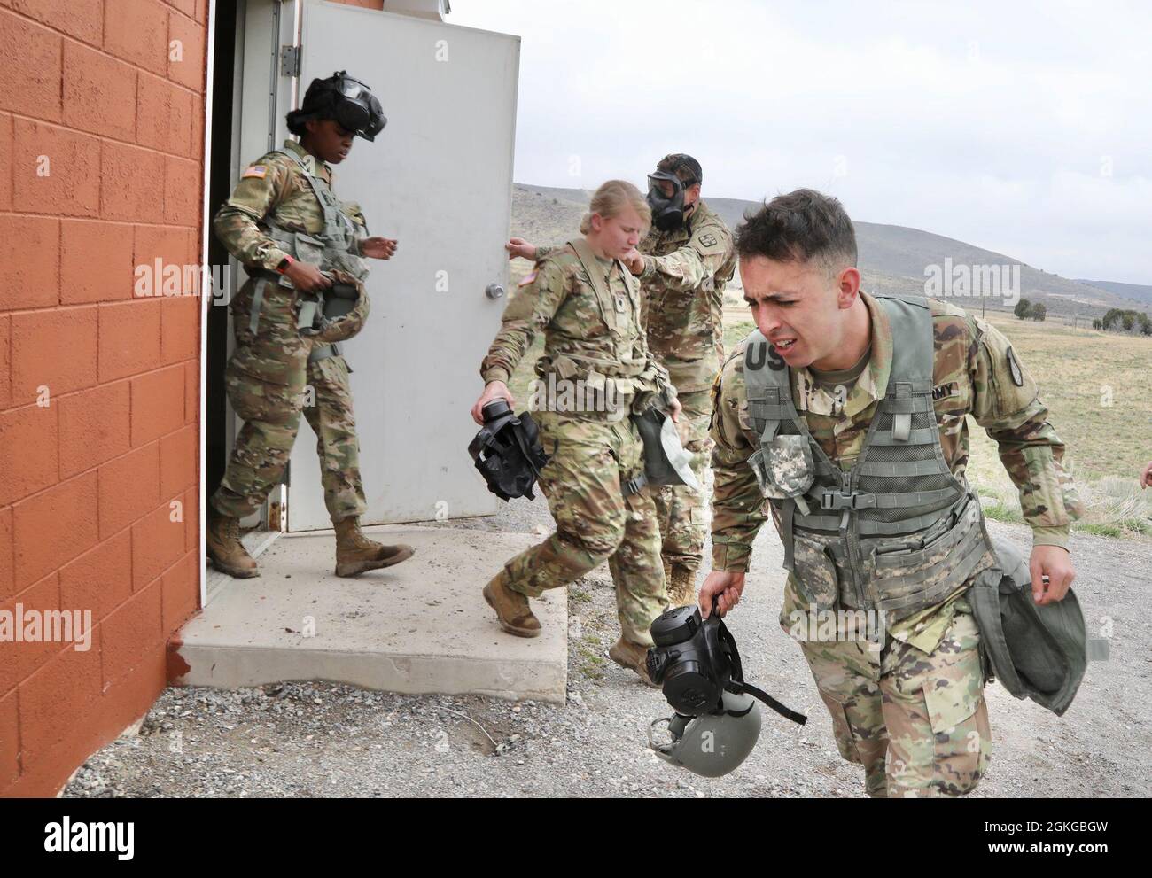 A group of Army Reserve Soldiers try and breathe fresh air as they exit ...