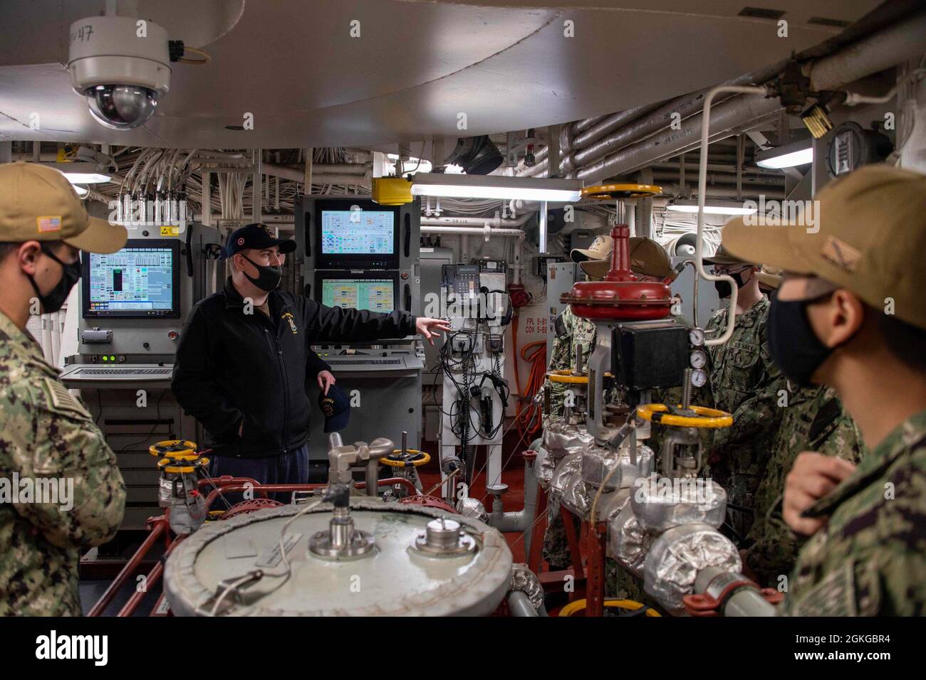 SASEBO, Japan (April 15, 2021) Ensign Timothy Garber, second from left ...