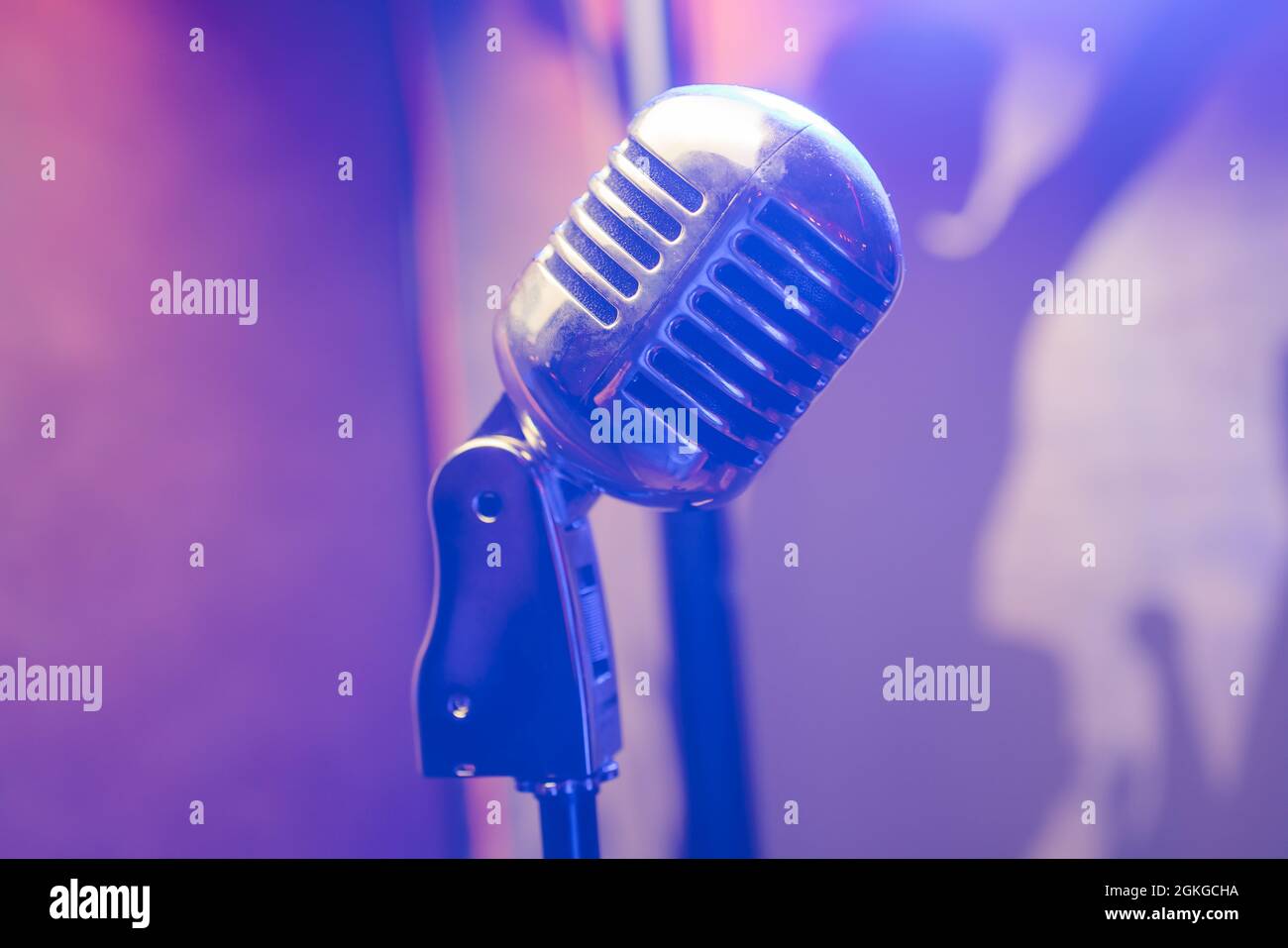 Retro microphone on stage in a pub or American Bar restaurant during a ...