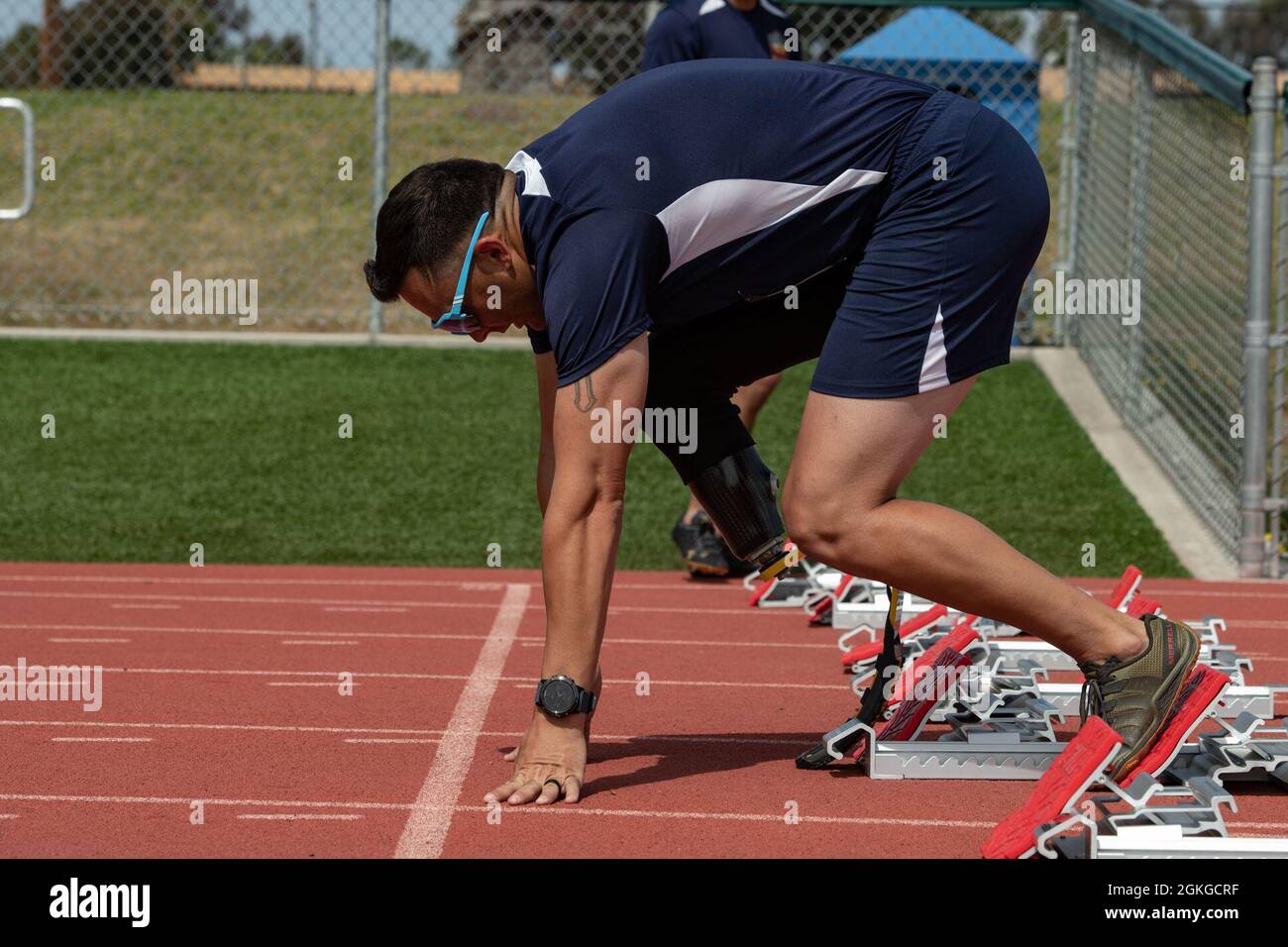 U.S. Marine Corps Capt. Thomas Benge competes in the track finals ...