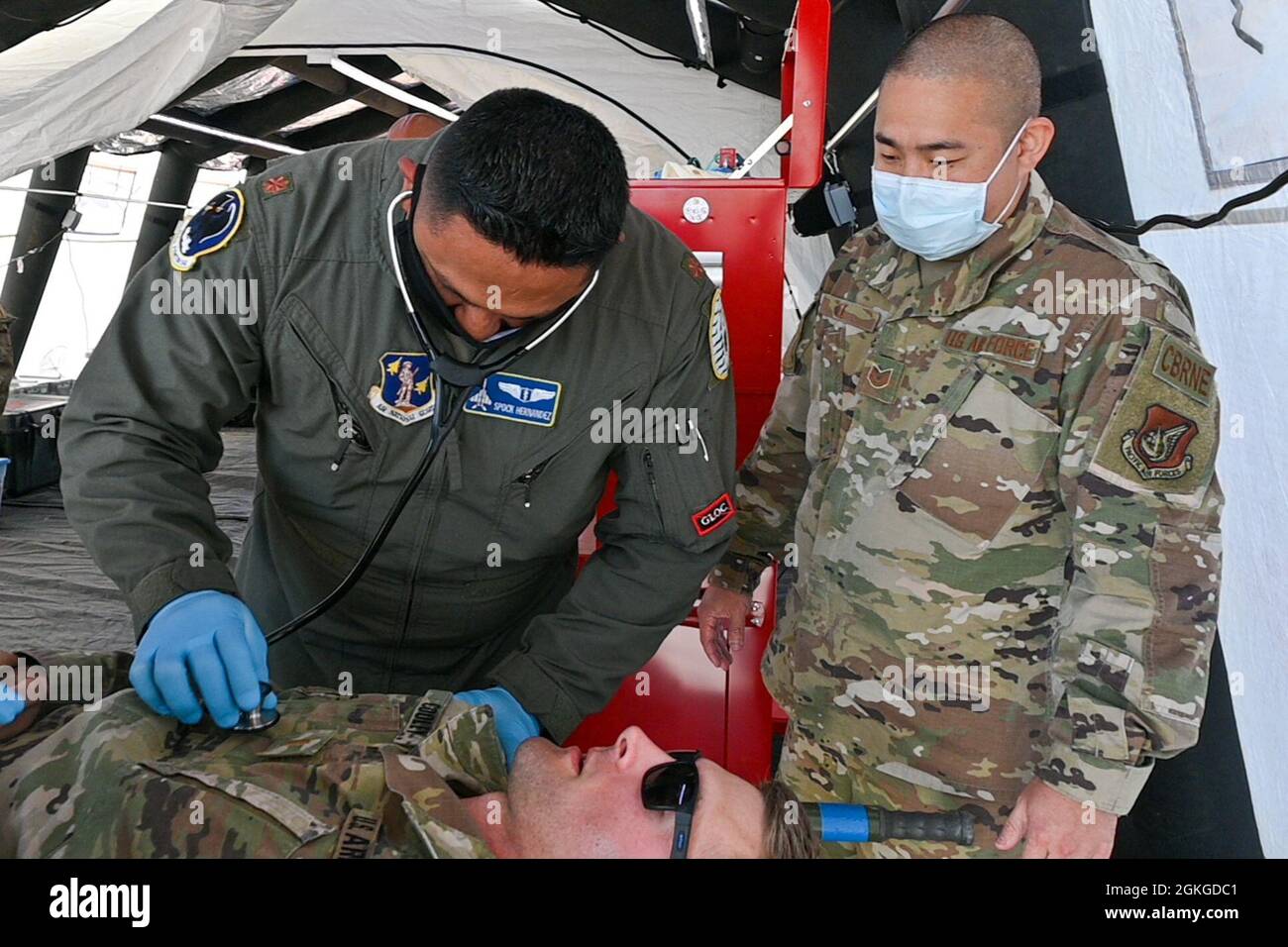 Maj. Alex Hernandez, 144th Medical Group flight surgeon and Tech. Sgt ...
