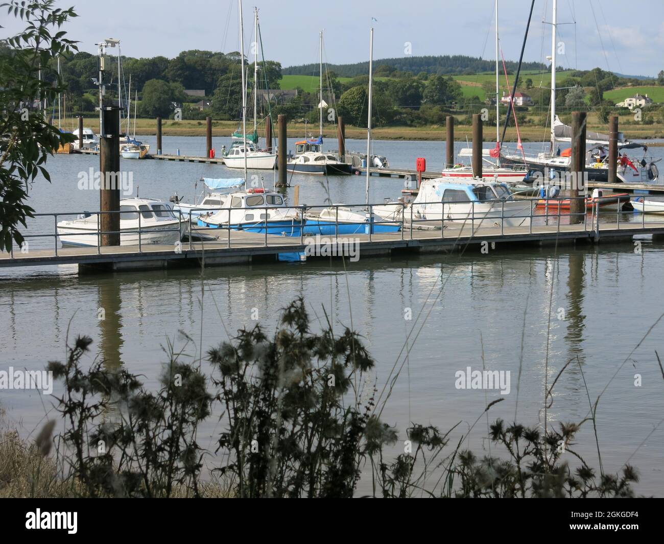 View looking out over Kirkcudbright marina with yachts and sailing ...