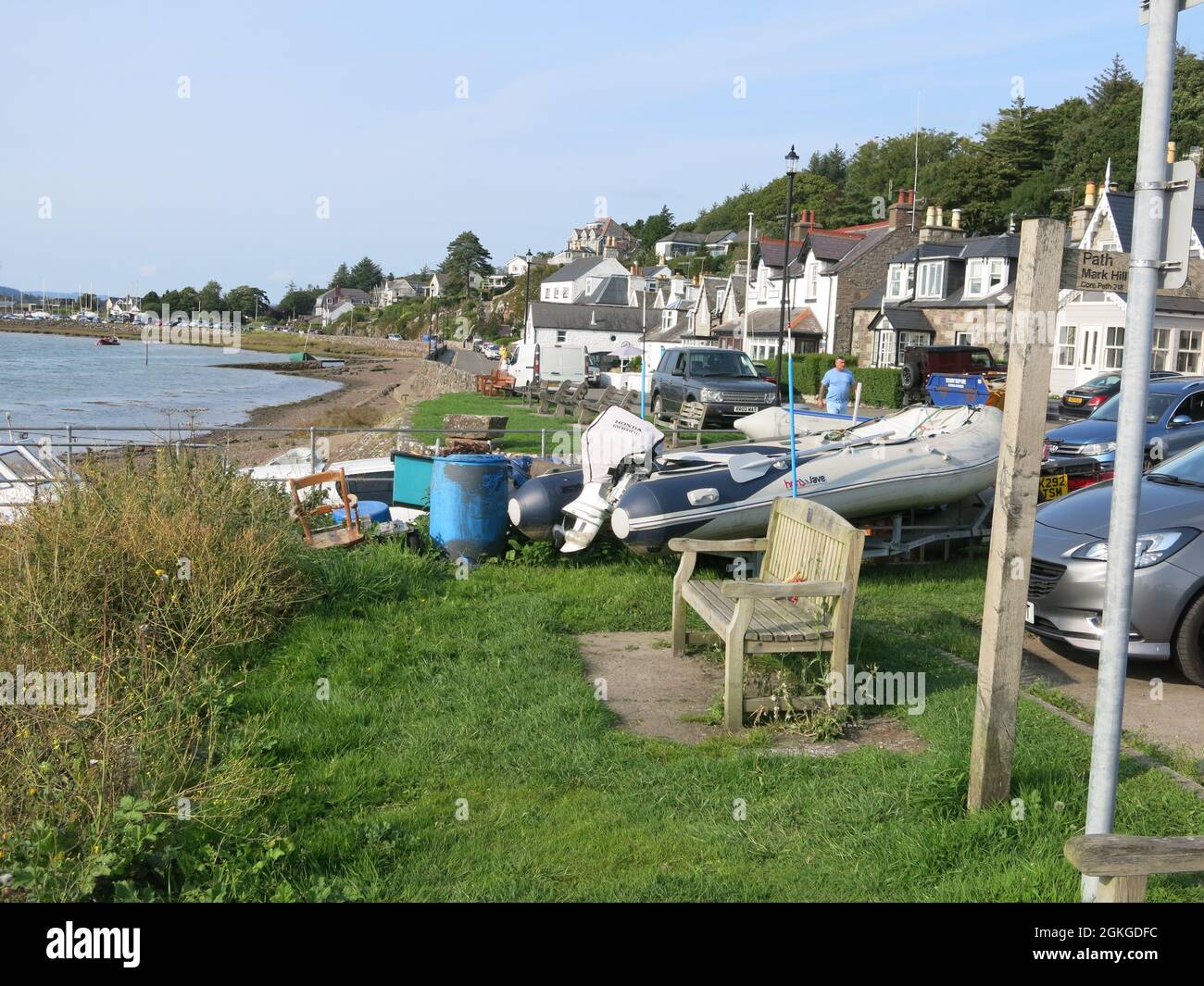 View of the coastal road through the village of Kippford, overlooking ...