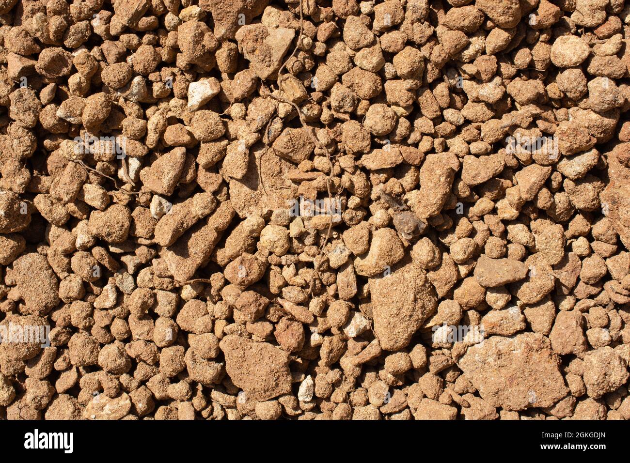 Closeup shot of many small stones on the ground under the hot sun Stock ...