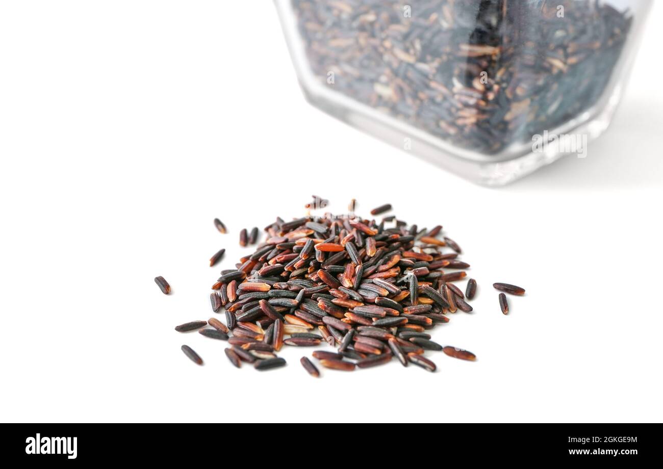Whole grain organic brown rice on white background Stock Photo - Alamy