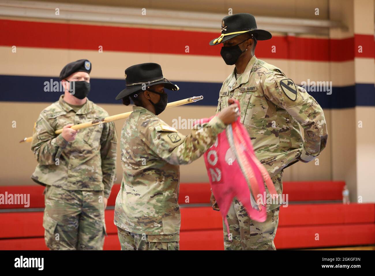 Capt. Neisha Bailey and 1st Sergeant Dameion Baylor remove the old 602 ...