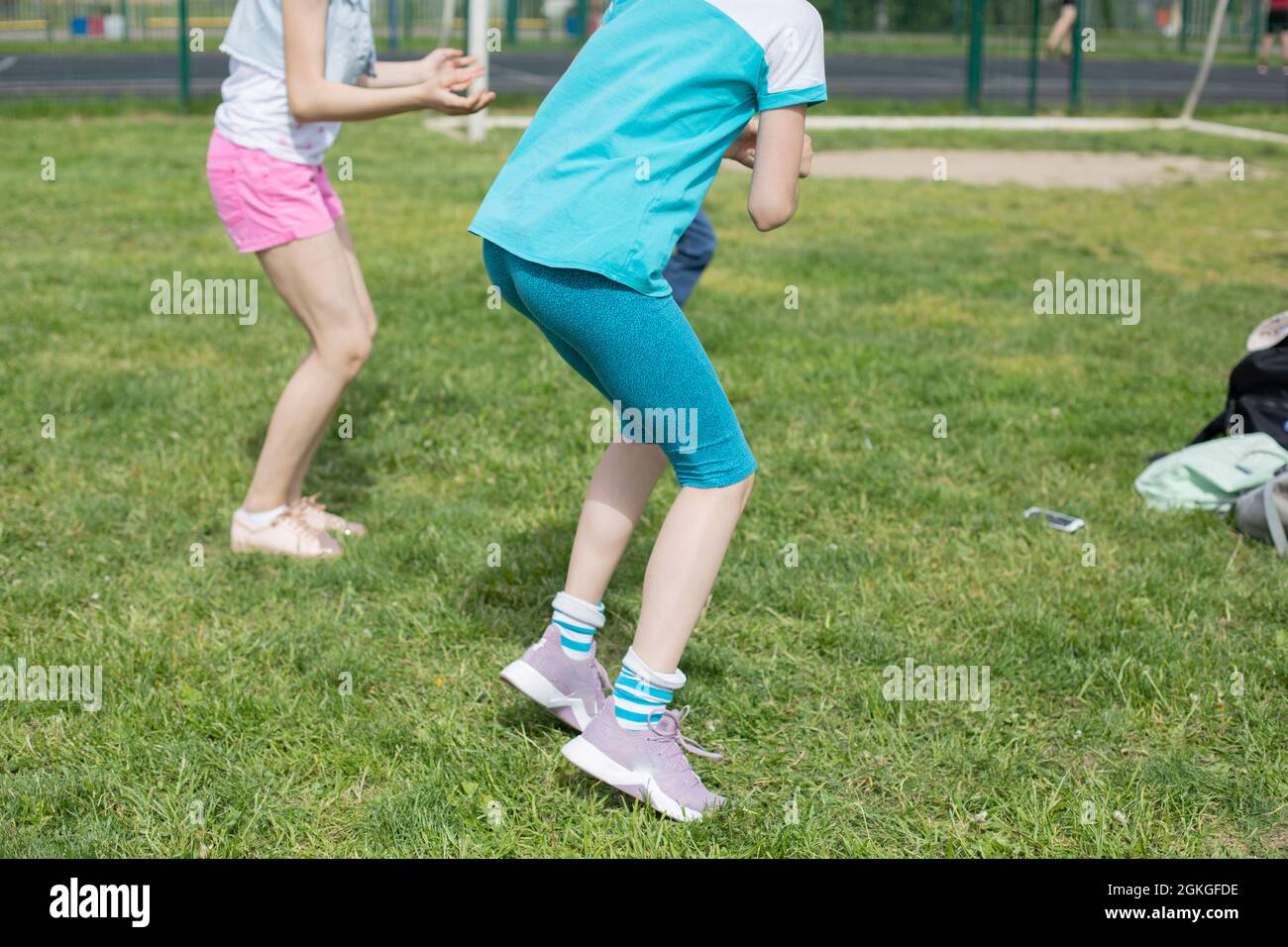 Children are dancing on the lawn. The girls are filming and dancing ...