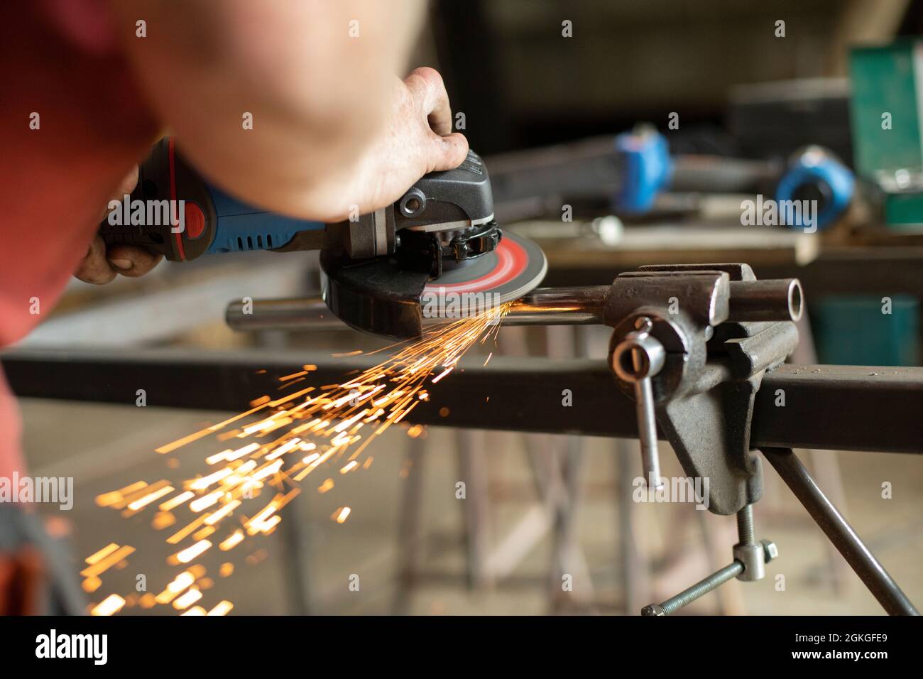 Metal grinding. Steel processing with power tools. A man is working on ...