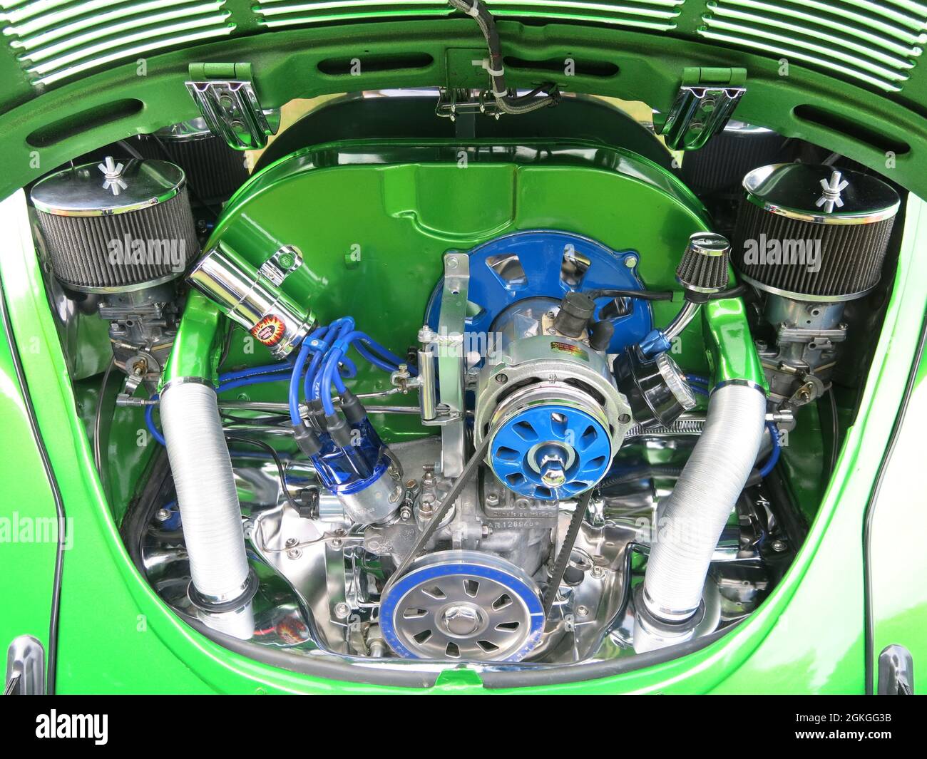 Close-up of a spotless engine in a rear wheel drive, green VW Beetle ...
