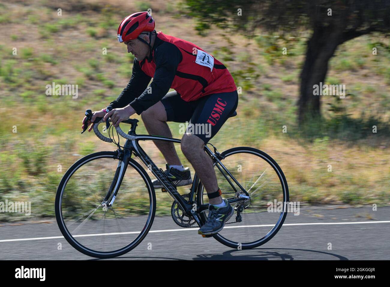 U.S. Marine Corps Capt. Adam Bodani competes in the cycling time trials ...