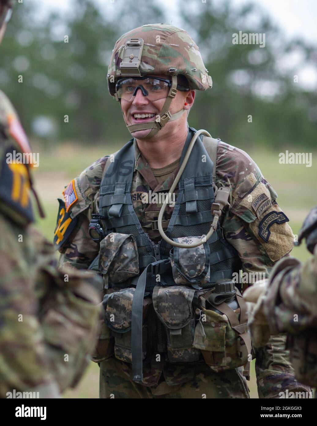 A U.S. Army Ranger talks with other competitors while participating in ...