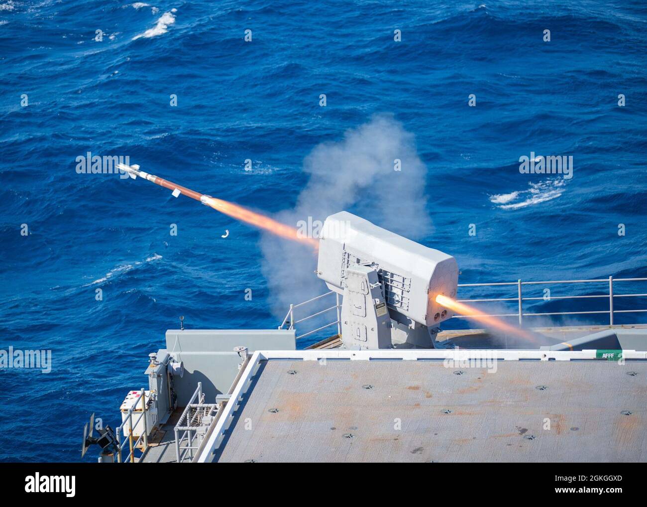 A rolling airframe missile (RAM) launcher fires a RIM-116 missile from ...