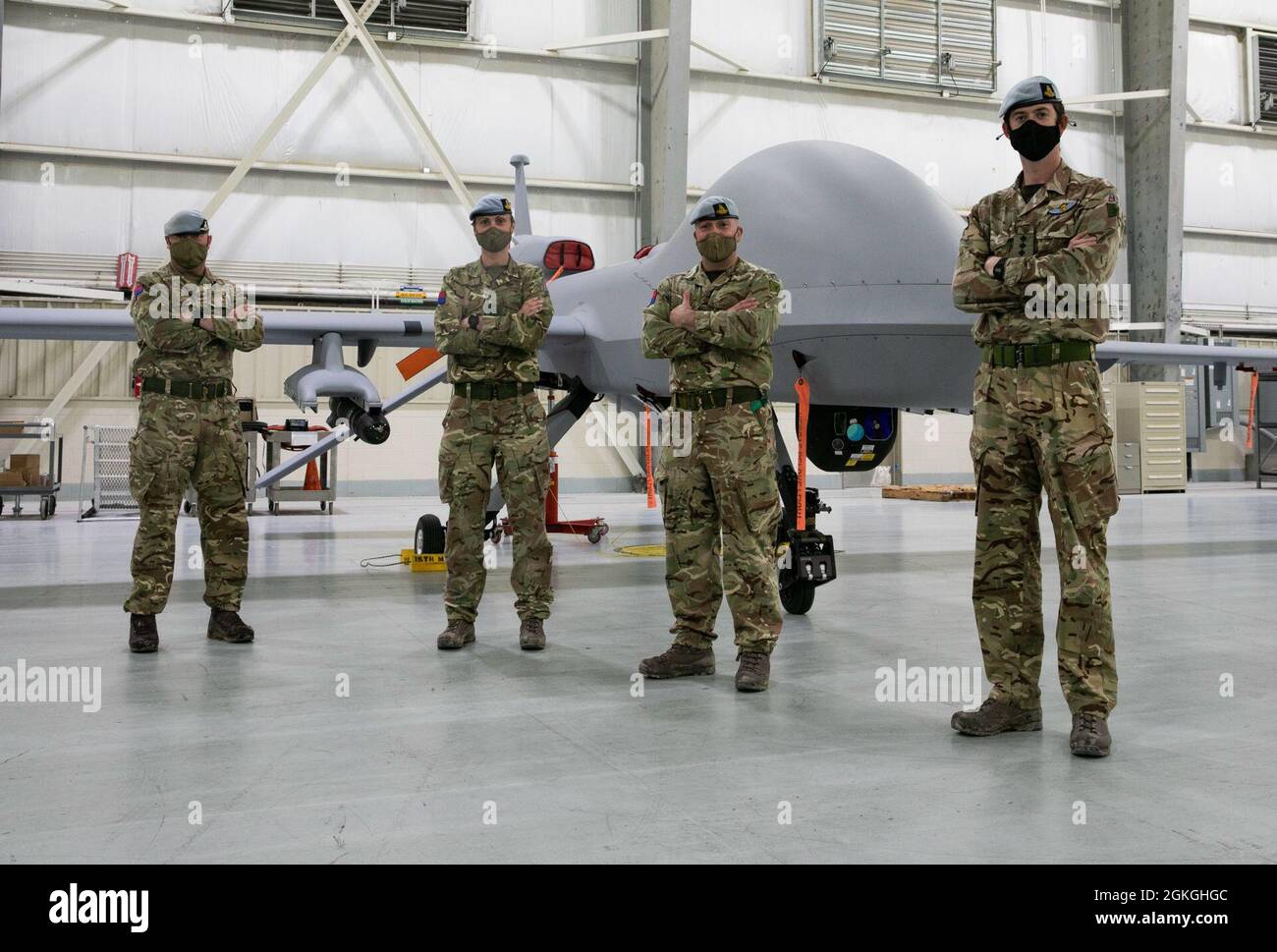 Soldiers with 47th Royal Artillery pose for a photo in front of a Grey ...