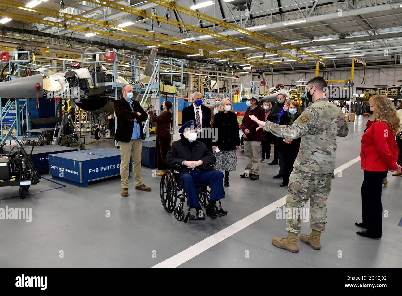 Air Force Col. (Ret.) Gail Halvorsen (center), is briefed by Lt. Col ...