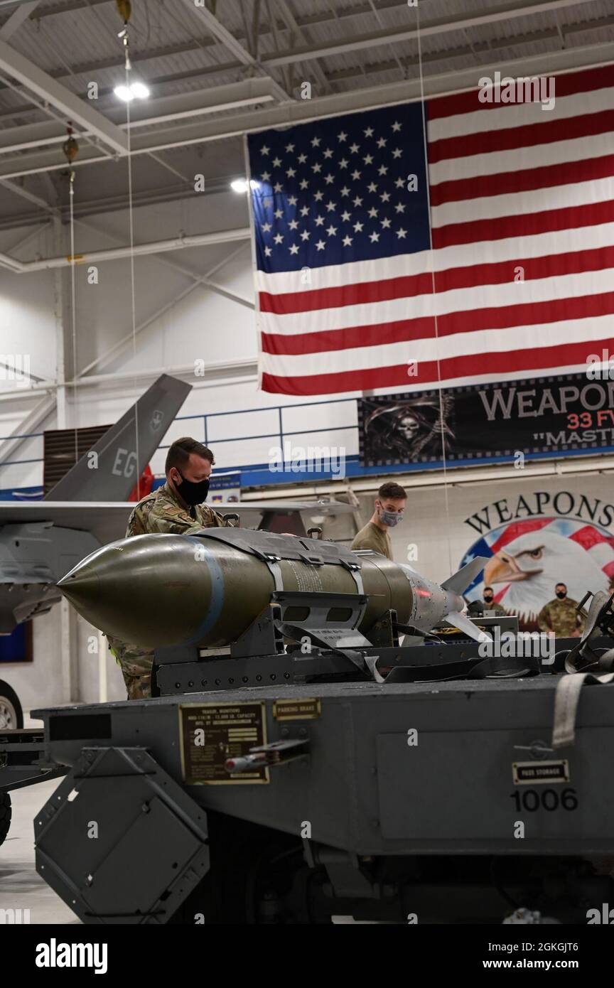 U.S. Air Force Senior Airman John Harmon, left, and Senior Airman Caleb Reyes, 33rd Aircraft ...
