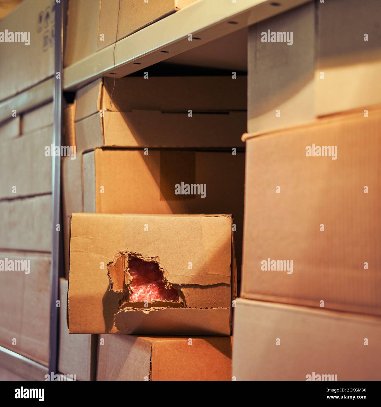 Stealing parcels and damaging the packaging of goods in the warehouse ...