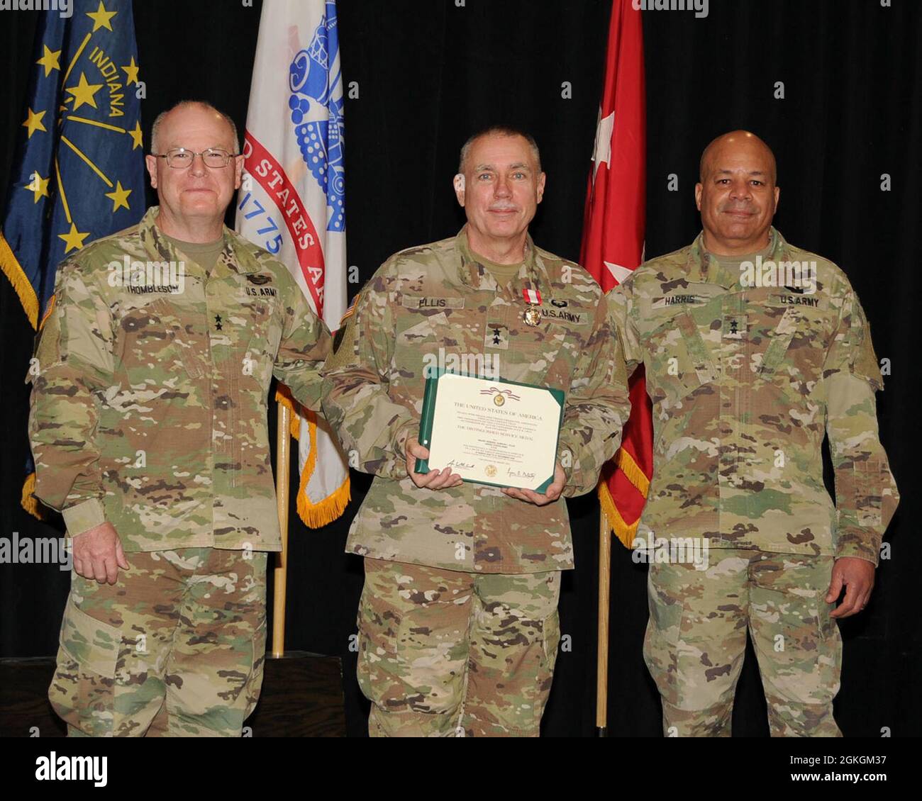 Retired Maj. Gen. Gordon L. Ellis (center) receives the Distinguished ...