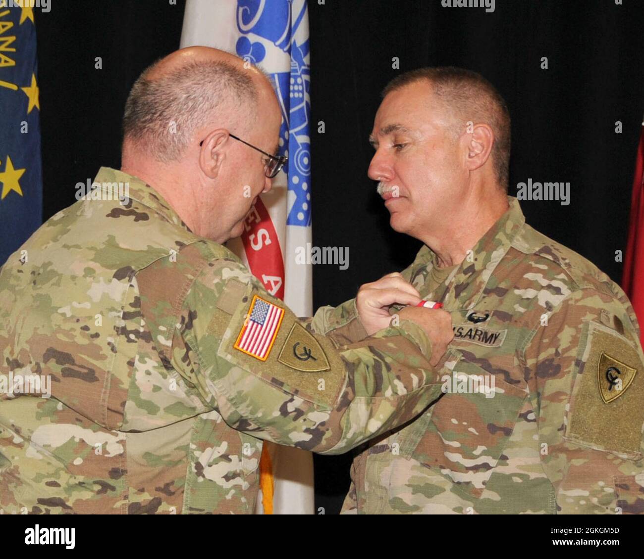 Retired Maj. Gen. Gordon L. Ellis (right) receives the Distinguished ...