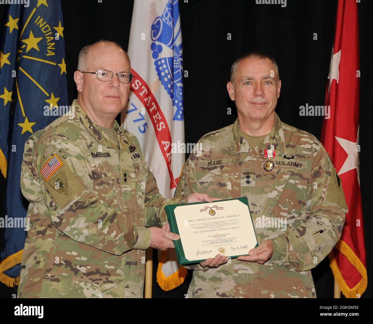 Retired Maj. Gen. Gordon L. Ellis (right) receives the Distinguished ...