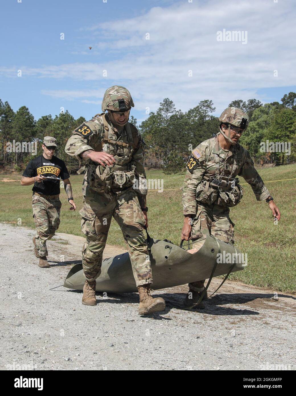 Team 33 pulls a sked stretcher while participating in a marksmanship ...