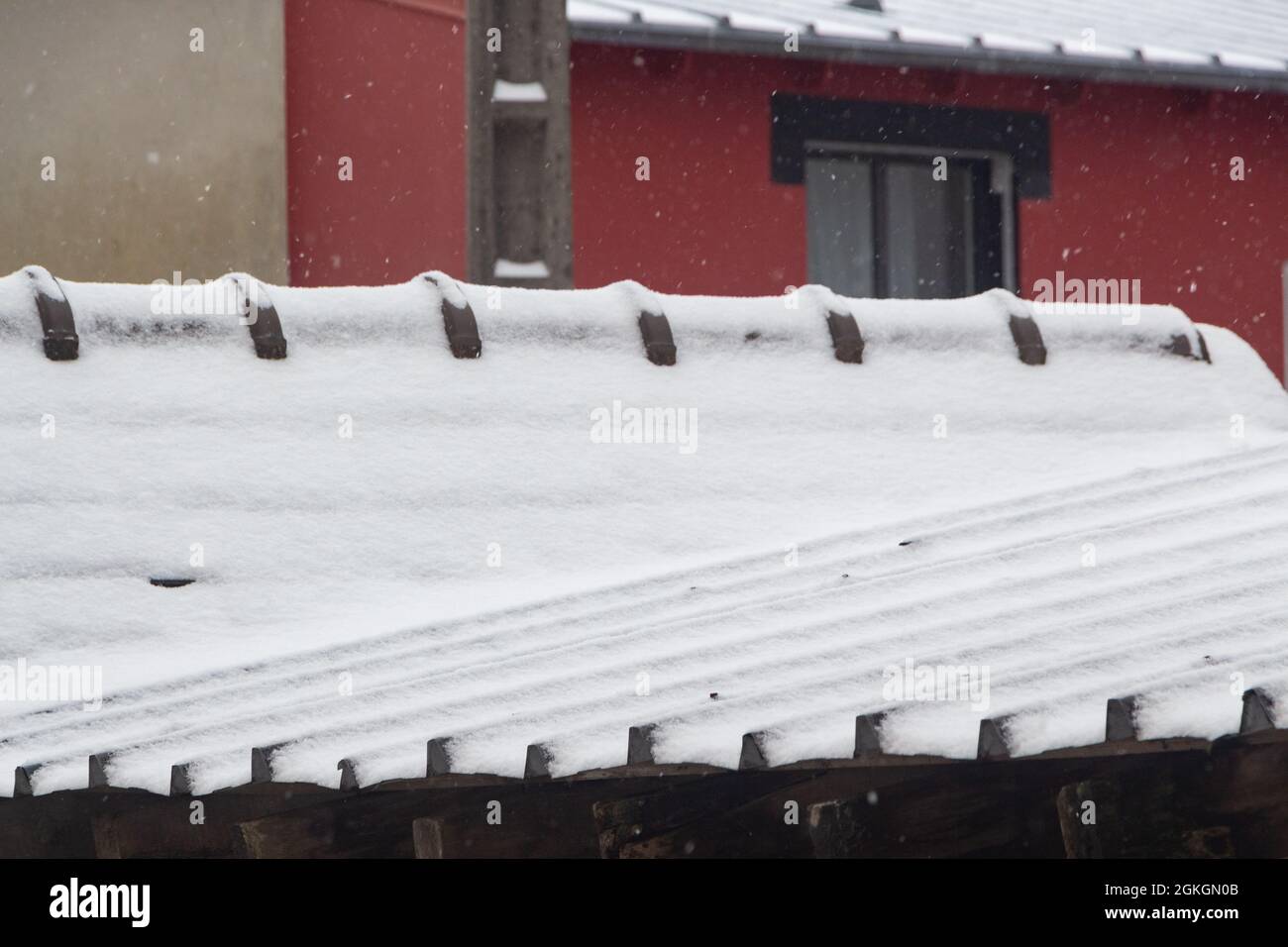 Snow falling on a roof in Brittany Stock Photo - Alamy
